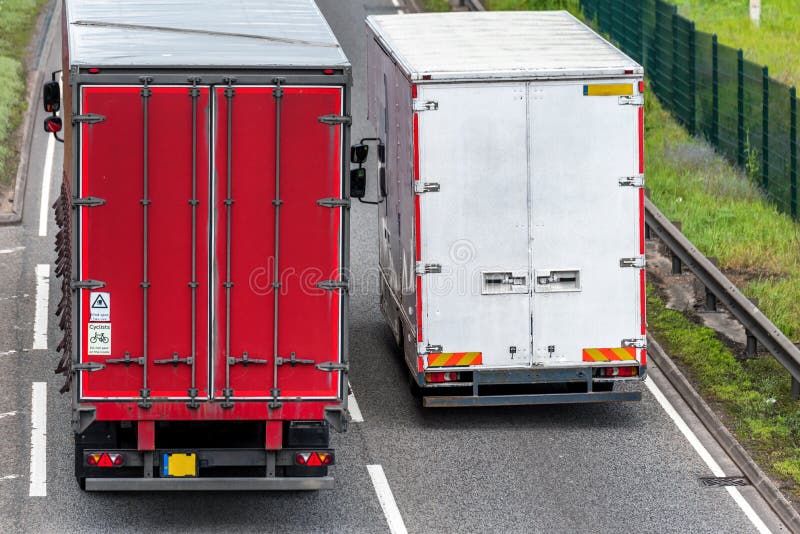 Two Box Lorry Trucks on Uk Motorway in Fast Motion Stock Image - Image ...