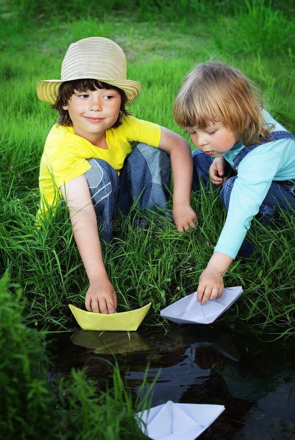 Two boy play in stream stock image. Image of blue, playing - 41325523