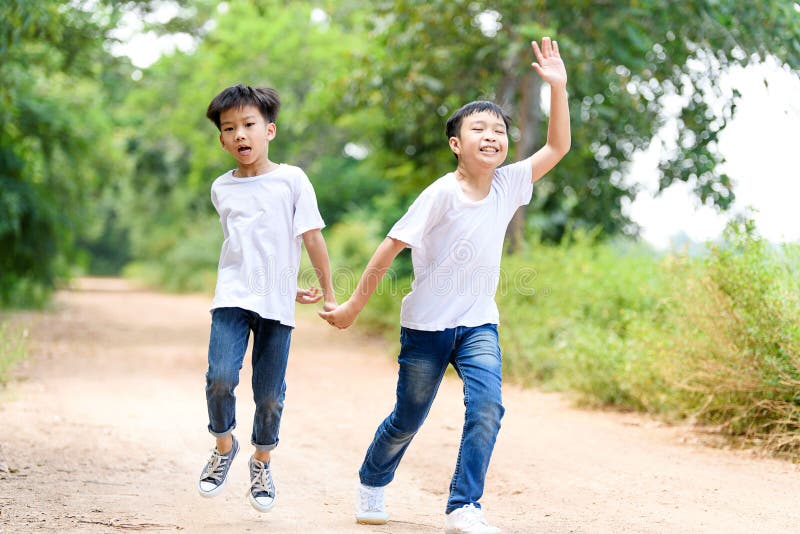 Two boy run in the park stock image. Image of blue, park - 85010567