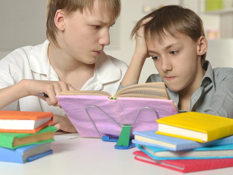 Two boys doing homework stock image. Image of leisure - 39527925