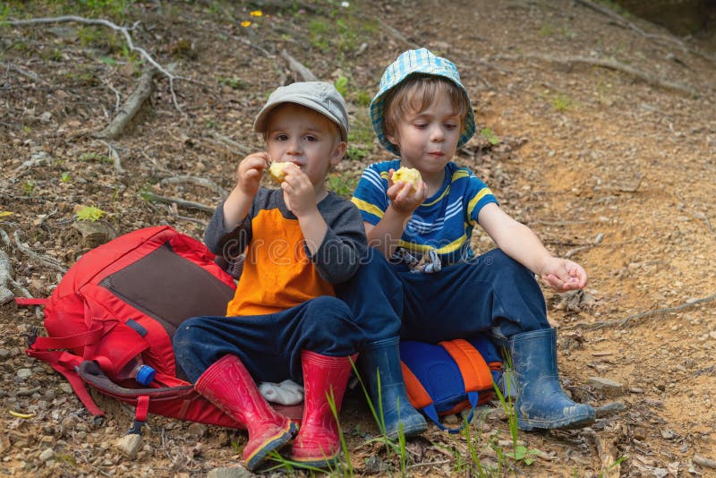 Two Boys Eating Apples. Snack during the Trip Stock Photo - Image of ...