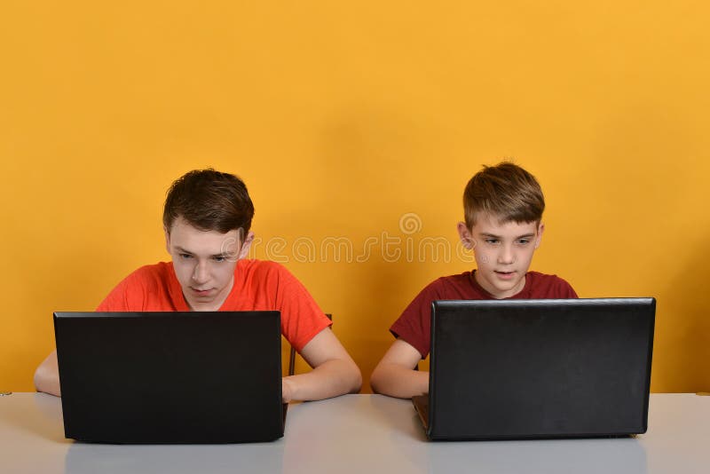 Two Boys are Engaged Online on Laptops, Network Games. Online Learning ...