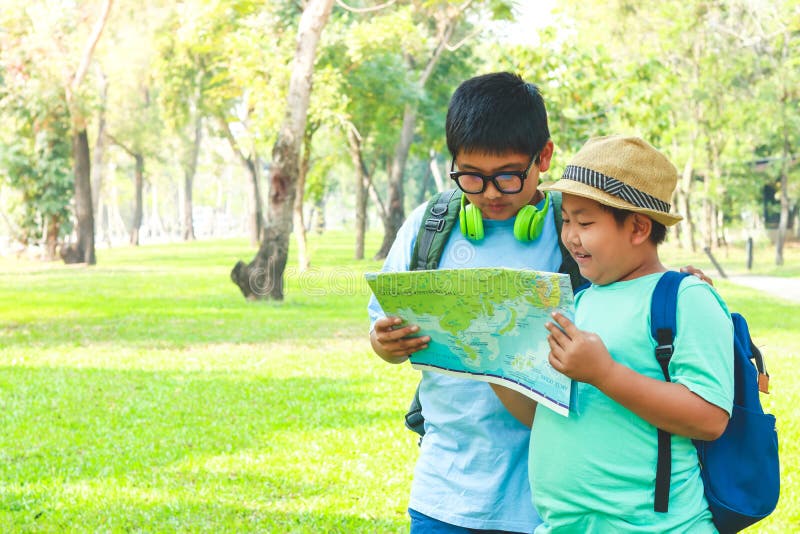 Two Boys on Field Trips Hold a World Map To Learn. Stock Photo - Image ...