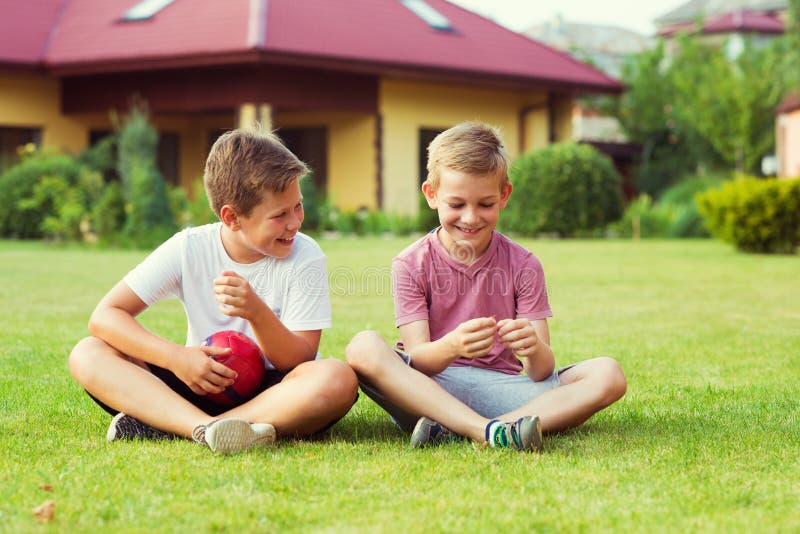 Two Boys Having Fun during Playing Football in Schoolyard Stock Photo ...
