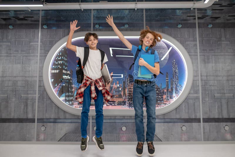 Two Boys Jumping and Looking Excited Stock Image - Image of jumping ...