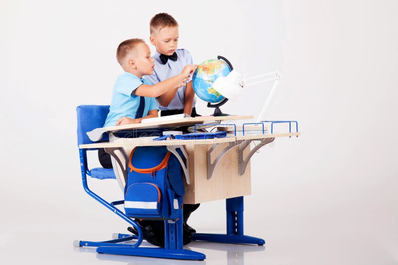 The Two Boys are Learning Globe for Desk at School Stock Image - Image ...