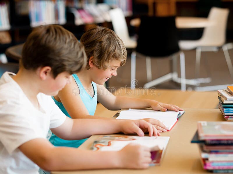 Two boys in library stock image. Image of learn, happy - 56207367
