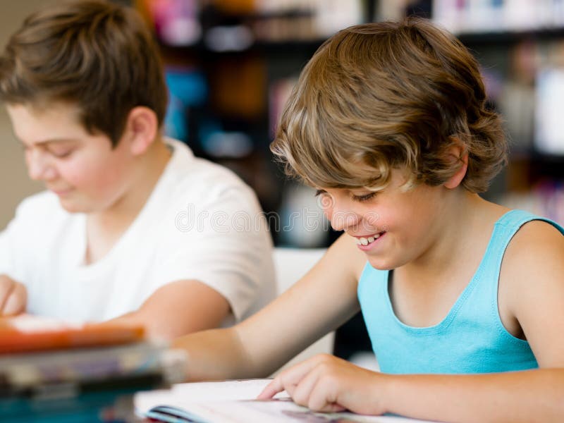 Two boys in library stock photo. Image of library, education - 56307328