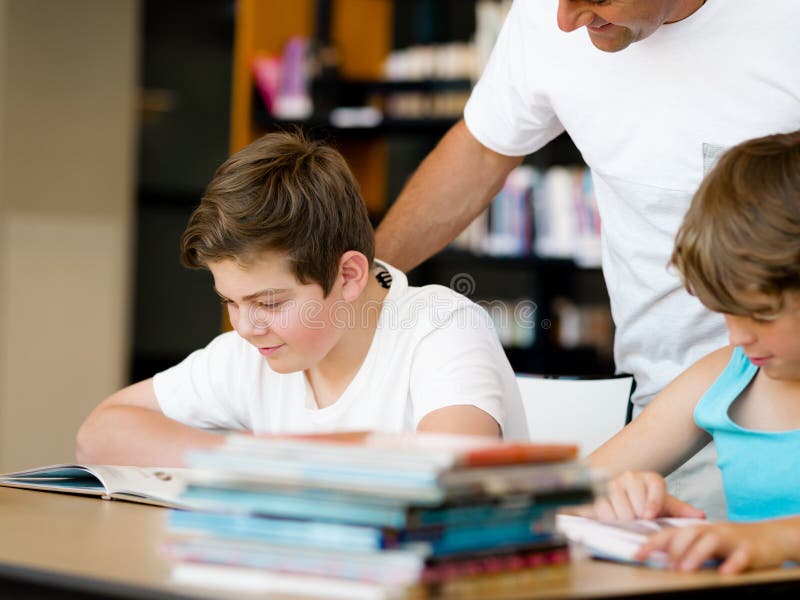 Two boys in library stock photo. Image of learn, knowledge - 94235412