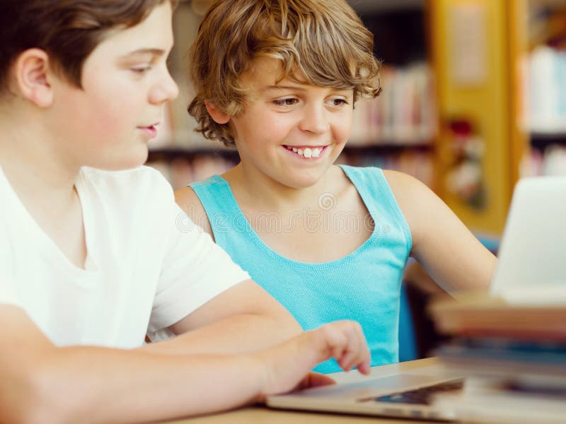 Two boys in library stock image. Image of knowledge - 101528047