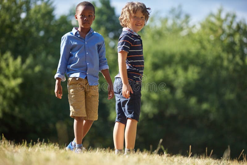 Two boys looking curious stock photo. Image of friendship - 87806748
