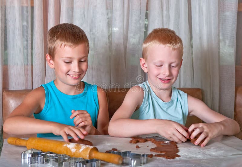 Two boys making cookies stock photo. Image of baking - 27848504