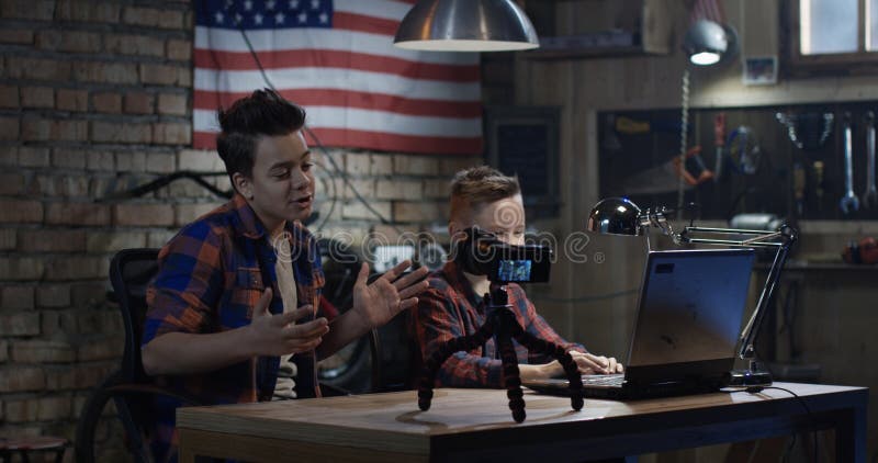 Two Boys Making a Video Blog in a Garage Stock Photo - Image of indoors ...