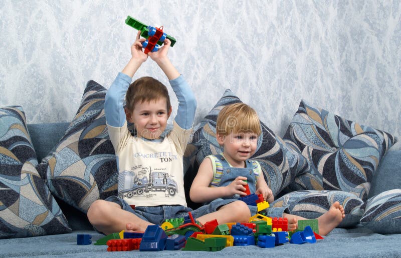 Two boys play toys stock image. Image of emotions, young - 7814623