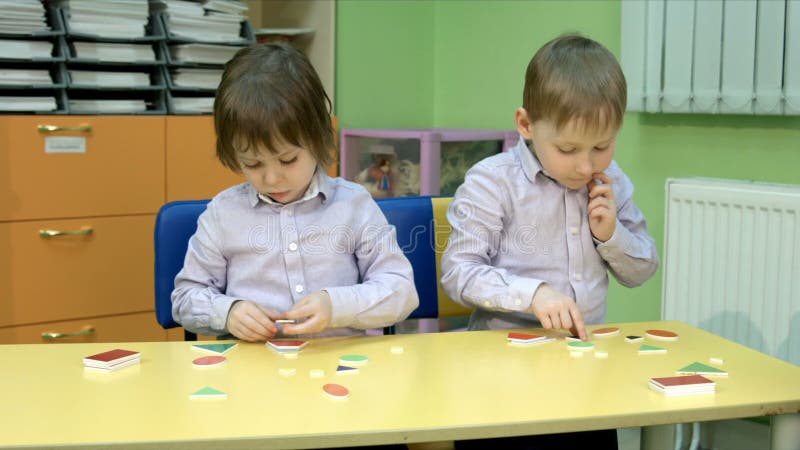 Two Boys Playing with Geometric Shapes Stock Footage - Video of ...