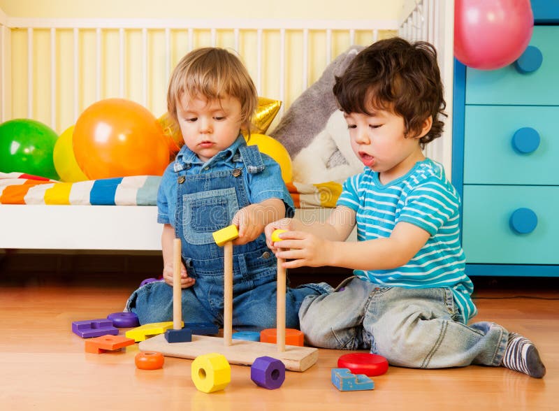 Two Boys Playing with Pyramid Blocks Stock Photo - Image of children ...