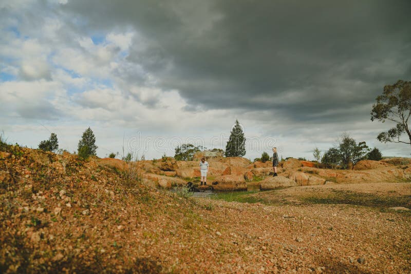 Two Boys Playing in Tranquil Waterhole in Australian Bush Setting Stock ...