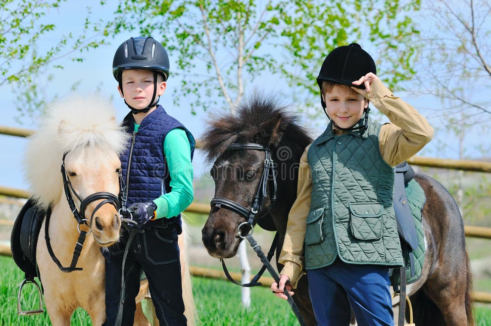 Two boys with ponies stock image. Image of activity, horseman - 28642539