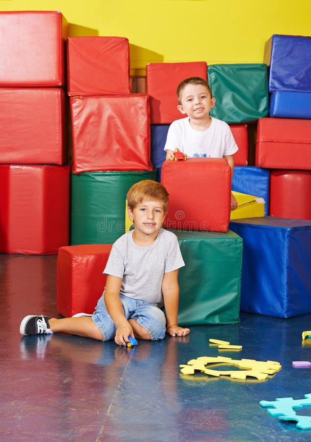Two boys in preschool gym stock image. Image of gymnastics - 79264955