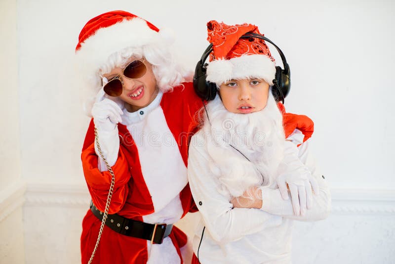 Two Boys Pretending he is a Bad Santa Stock Image - Image of aggressive ...
