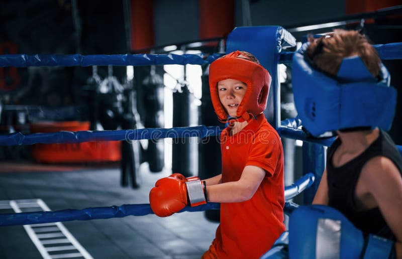 Two Boys in Protective Equipment Have Sparring and Fighting on the ...