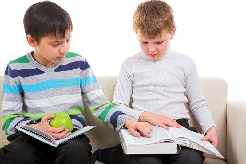 Two boys reading big book stock image. Image of reading - 81764553