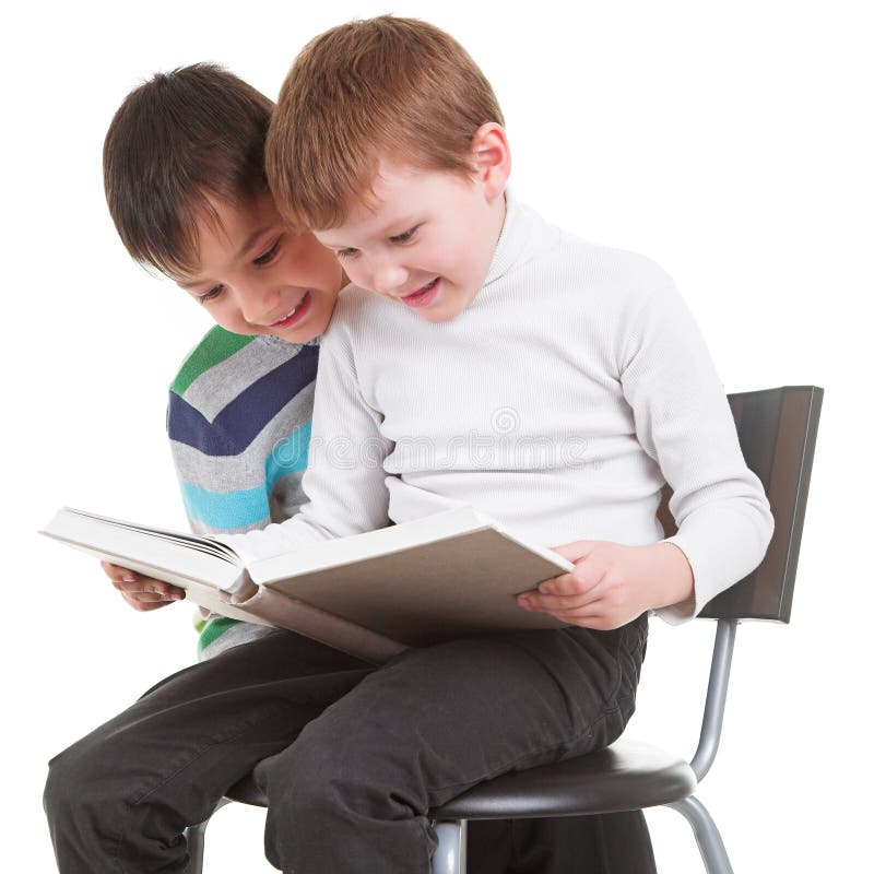 Two boys reading big book stock photo. Image of studio - 82710288