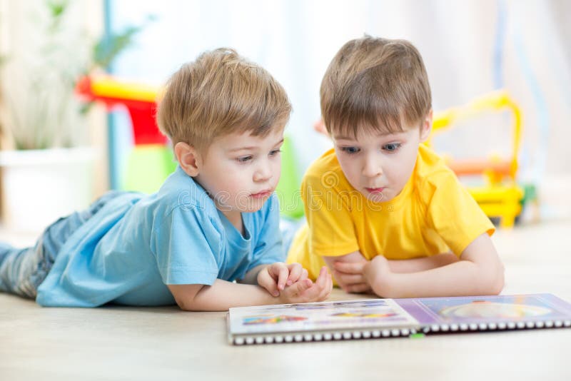 Two Boys Reading a Book Together Stock Photo - Image of child, friends ...