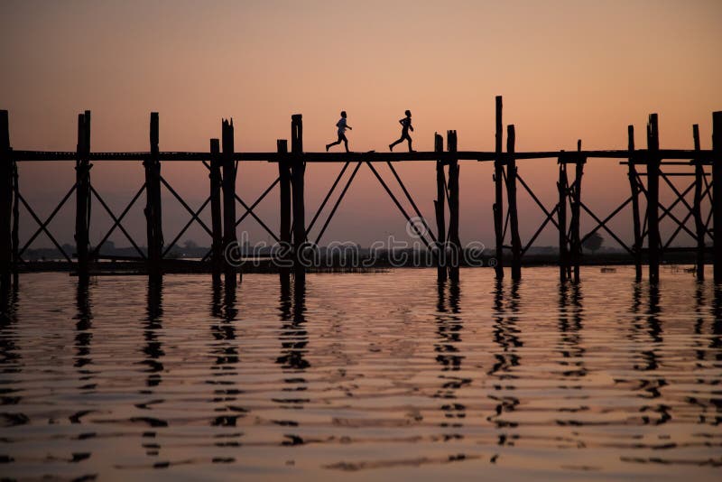Two boys running in bridge stock image. Image of footbridge - 173123419