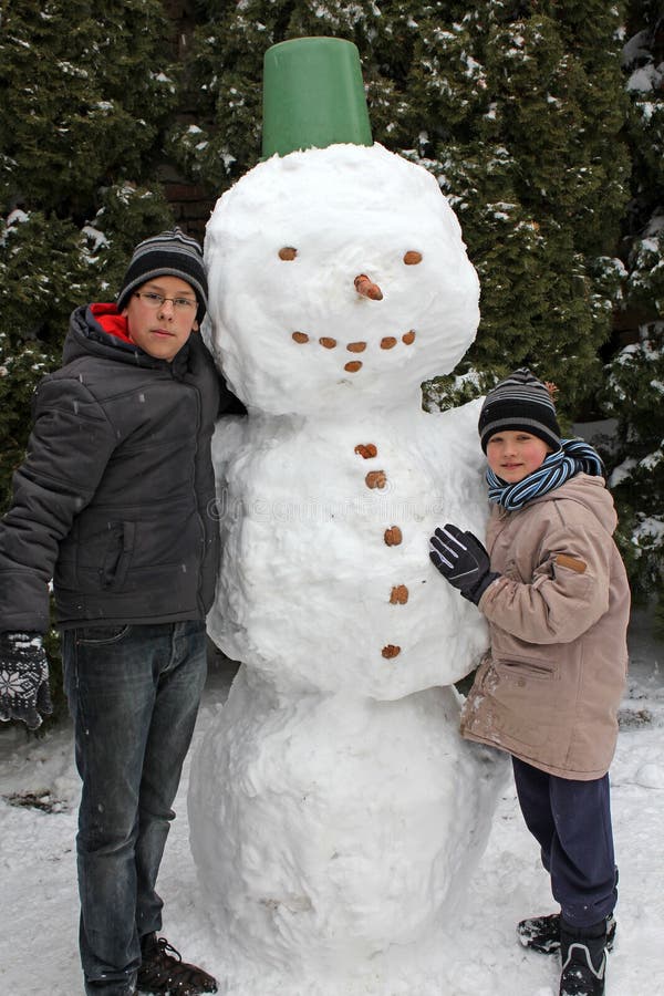 Two Boys in the Snowman Costume Stock Photo - Image of boys, vertical ...