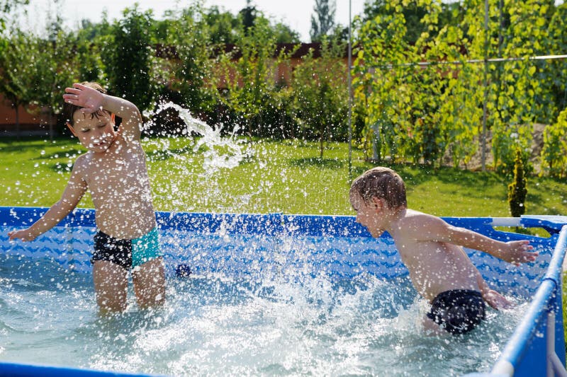 Two boys splashing stock image. Image of friends, paradise - 49467699