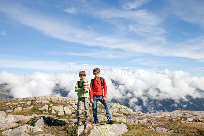 Two Boys Stand on Top in High Mountain Stock Image - Image of mont ...