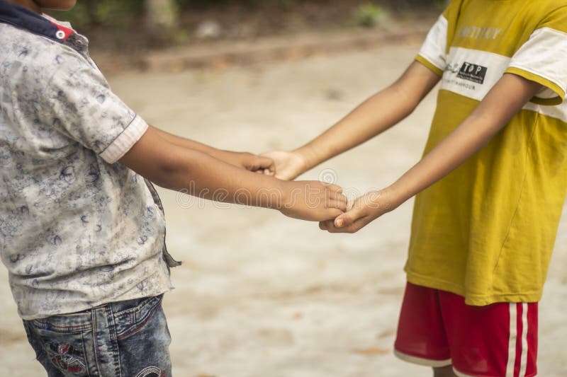 Two Boys Standing Together Shaking Hands Stock Image - Image of skin ...