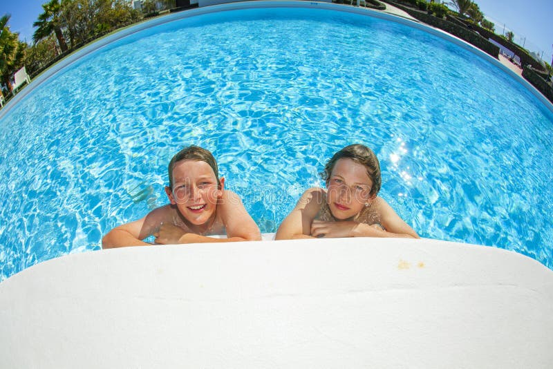 Two Boys Swimming in the Pool Stock Image - Image of little, holiday ...