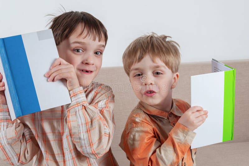 Two Boys Were Reading Books. they Looked Out of the Books at the Same ...