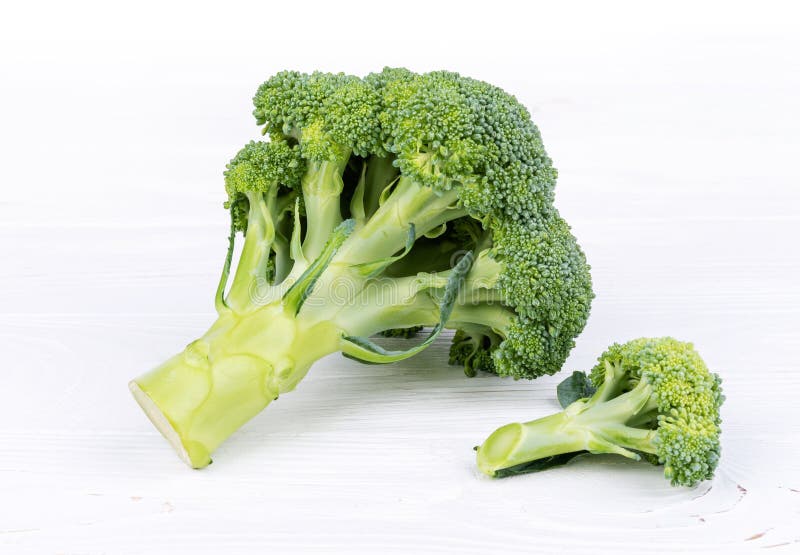 Two Branches of Fresh Broccoli on a White Table Stock Image - Image of ...