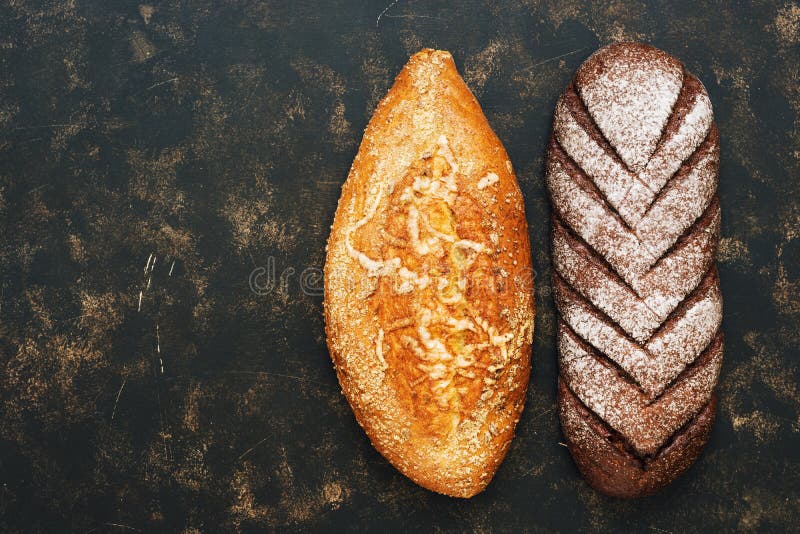 Two Breads on a Rustic Black Background, Copy Space, Top View. Stock ...