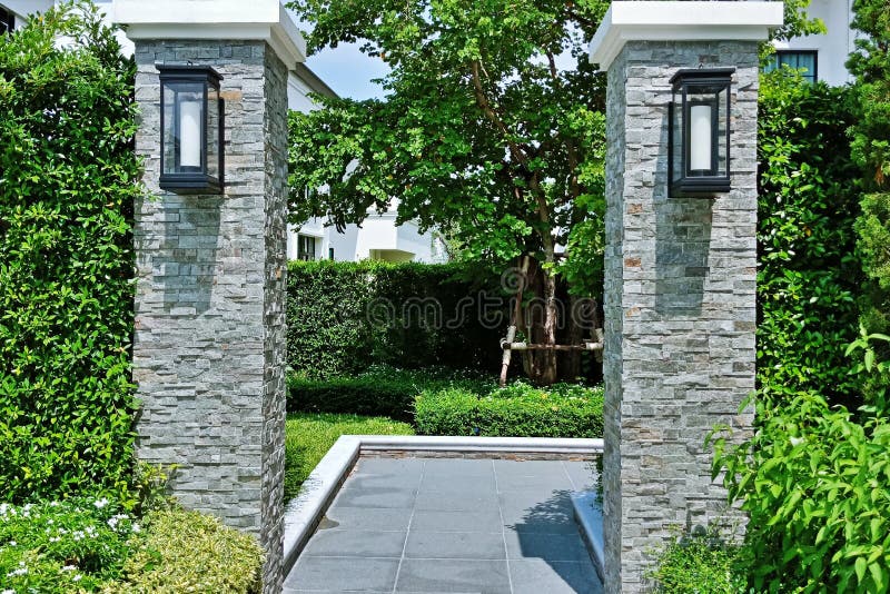 Two Brick Columns with Lights To the Garden Stock Photo - Image of ...