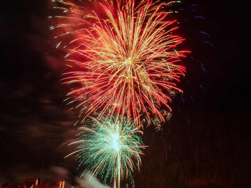 Two Bright Flashes of Fireworks in Red and Turquoise Shades Stock Image ...