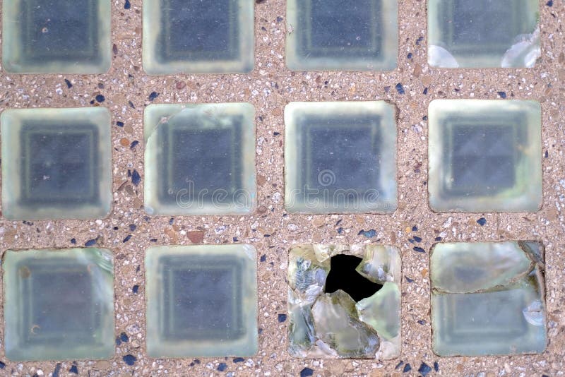 Two Broken Glass Blocks in the Concrete Wall Stock Photo - Image of ...