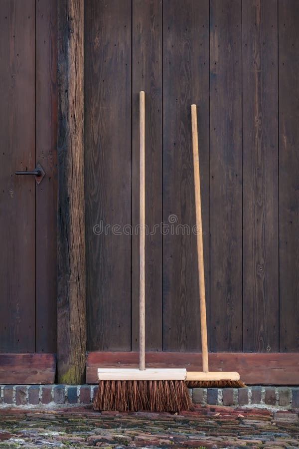 Two Brooms in Front of an Old Barn Stock Photo - Image of home ...