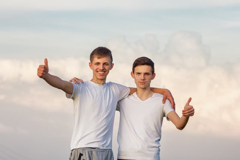 Two Brother Guys Stand Against the Sky Happy Stock Photo - Image of ...