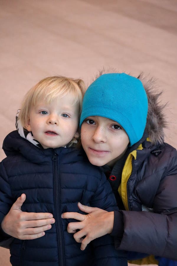 Two Brothers Children Playing on the Sand Beach by the Sea Stock Photo ...