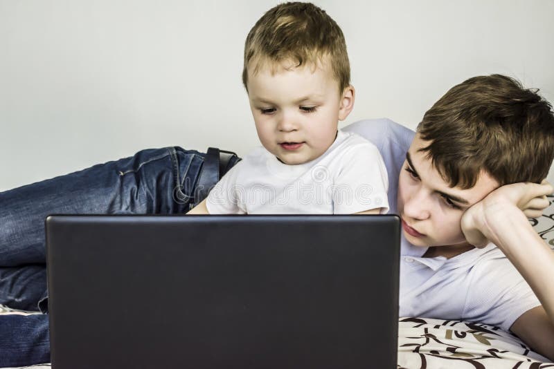 Two brothers stock image. Image of brothers, laptop, watch - 53054577