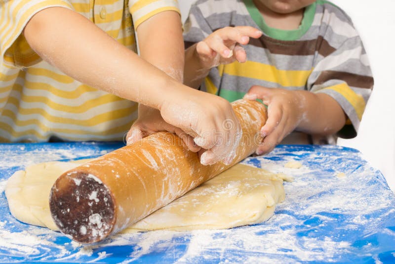 Two Brothers Cook Dough for a Pie Stock Photo - Image of blue, stained ...