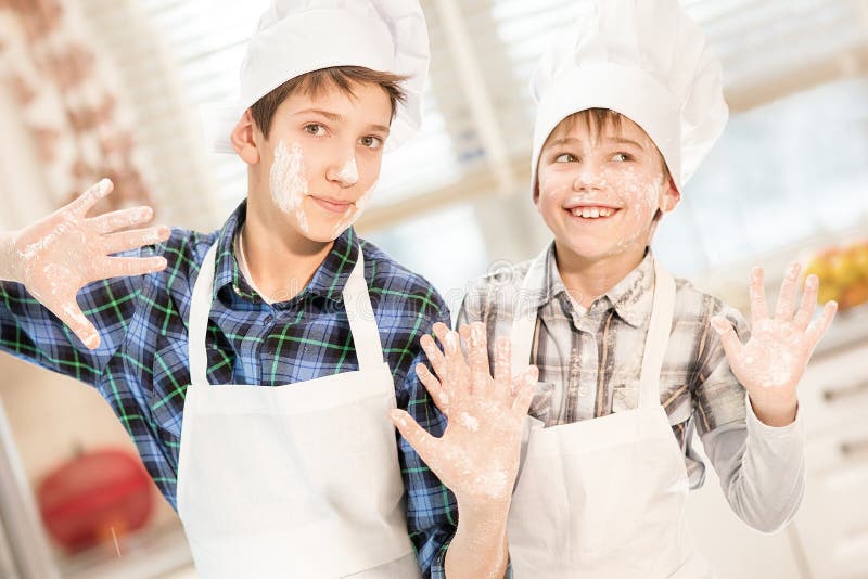 Two brothers in cook hats. stock image. Image of home - 87239001