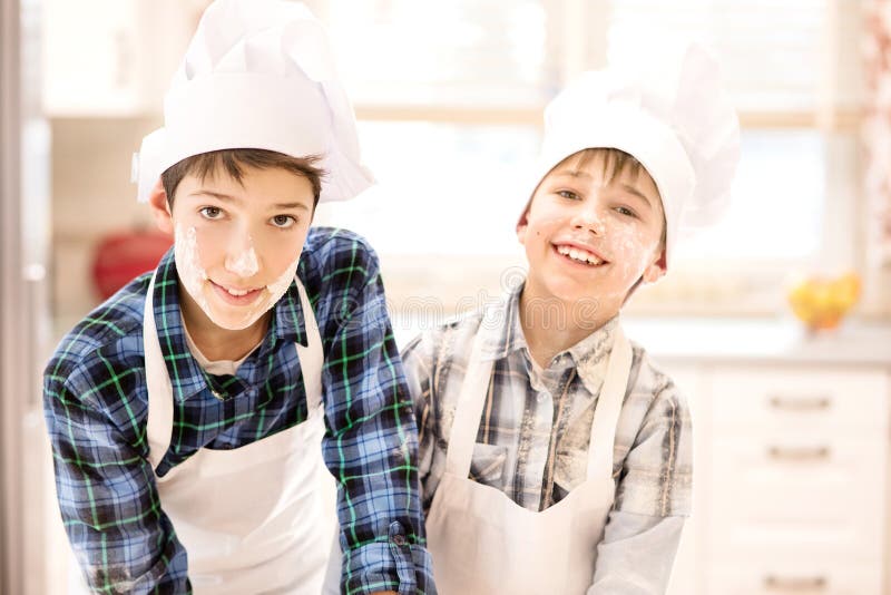 Two brothers in cook hats. stock image. Image of kitchen - 87239157