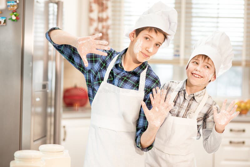 Two brothers in cook hats. stock image. Image of happiness - 87239235