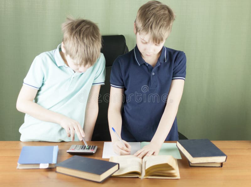 Two Brothers Doing Homework at the Desk Stock Photo - Image of brother ...
