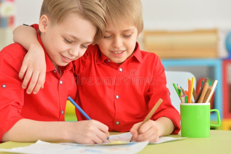 Two Brothers Draws with Pencils Stock Photo - Image of portrait, paper ...